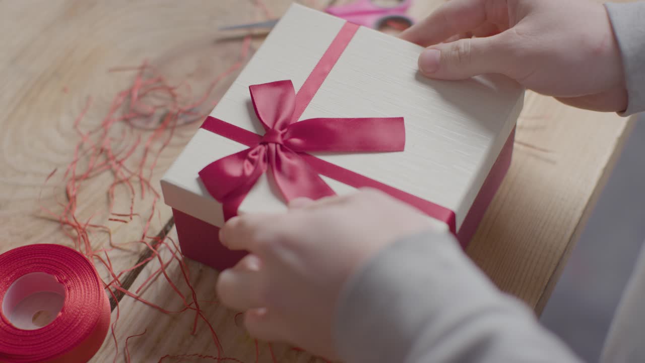 Free stock video - Close up shot of man gift wrapping romantic ...
