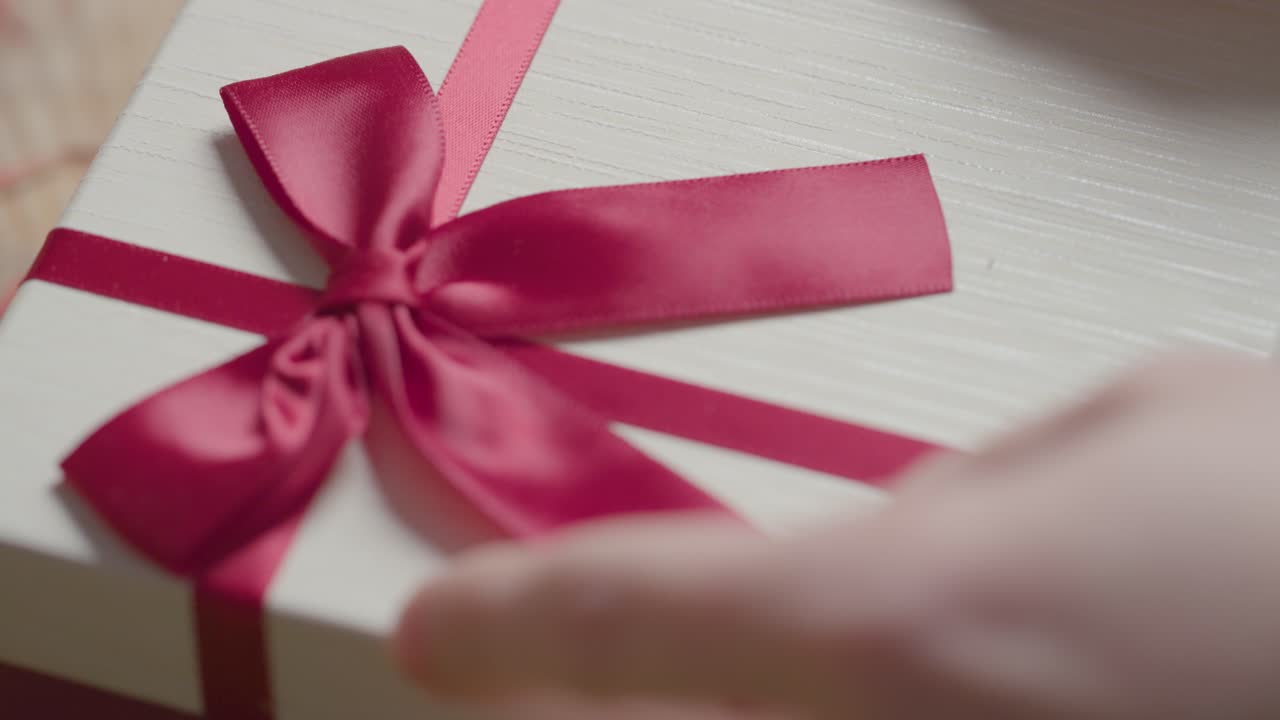 Free stock video - Close up shot of man gift wrapping romantic ...