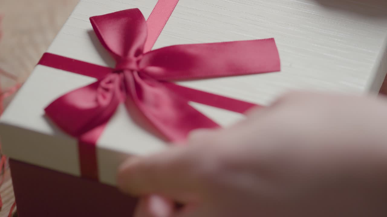 Free stock video - Close up shot of man gift wrapping romantic ...