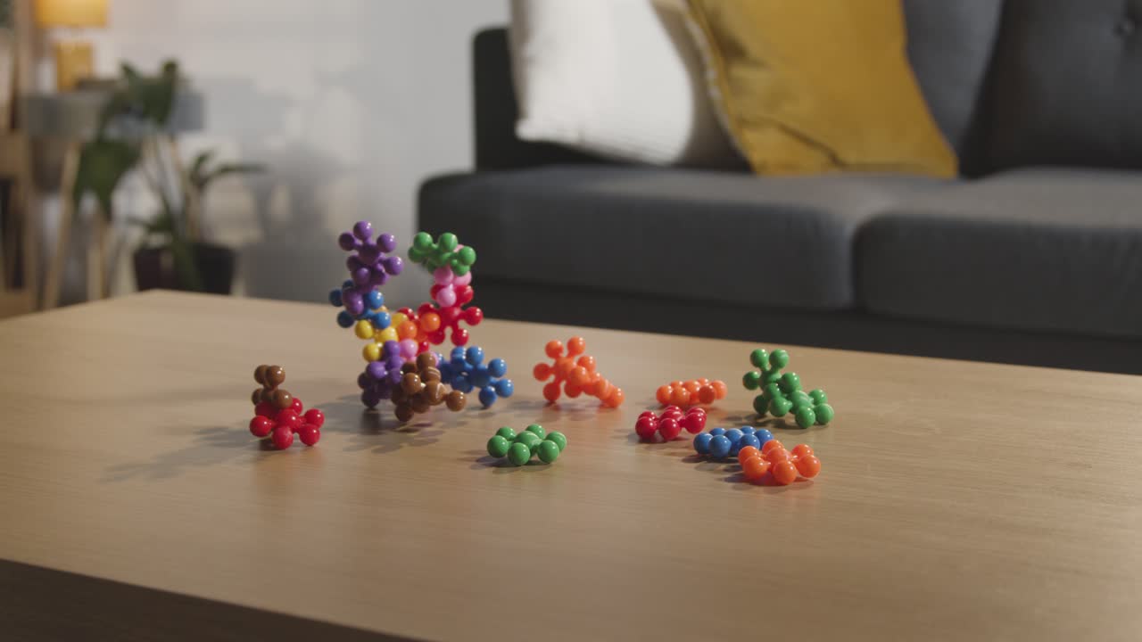 Free stock video - Coloured interlocking shape puzzle on table at home ...