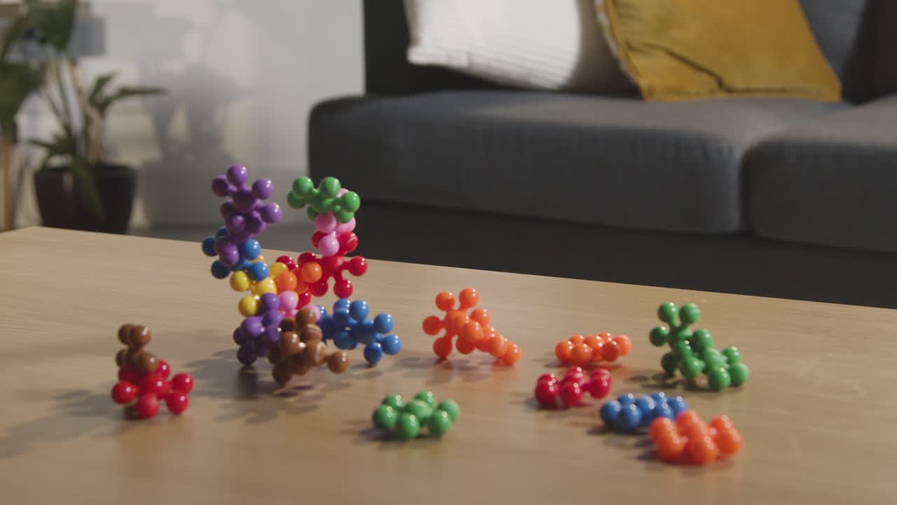 Free stock video - Coloured interlocking shape puzzle on table at home ...