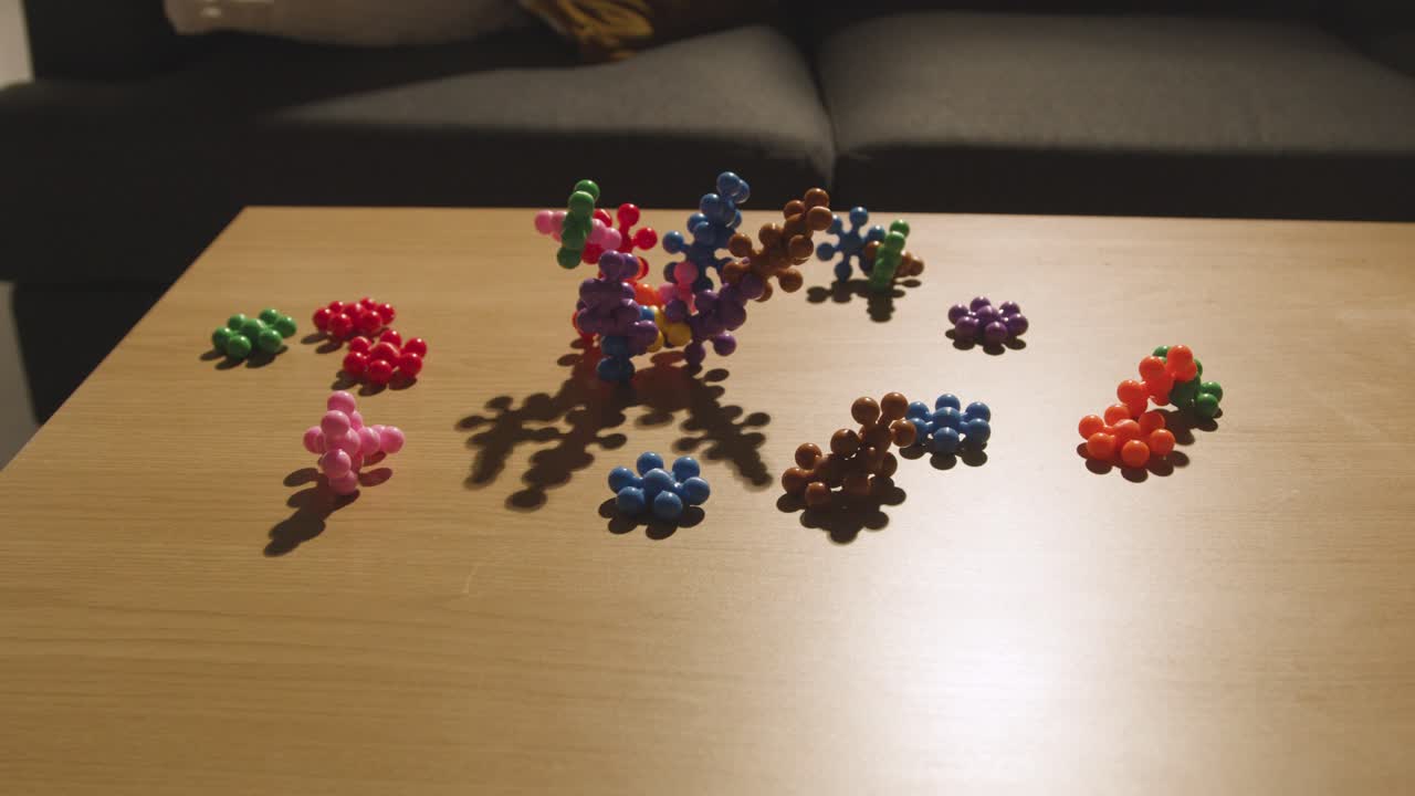 Free stock video - Coloured interlocking shape puzzle on table at home ...