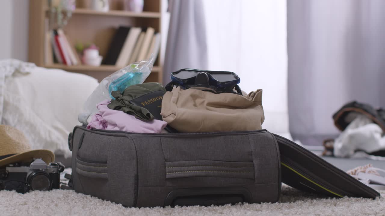 Free stock video - Open suitcase in bedroom at home being packed for ...