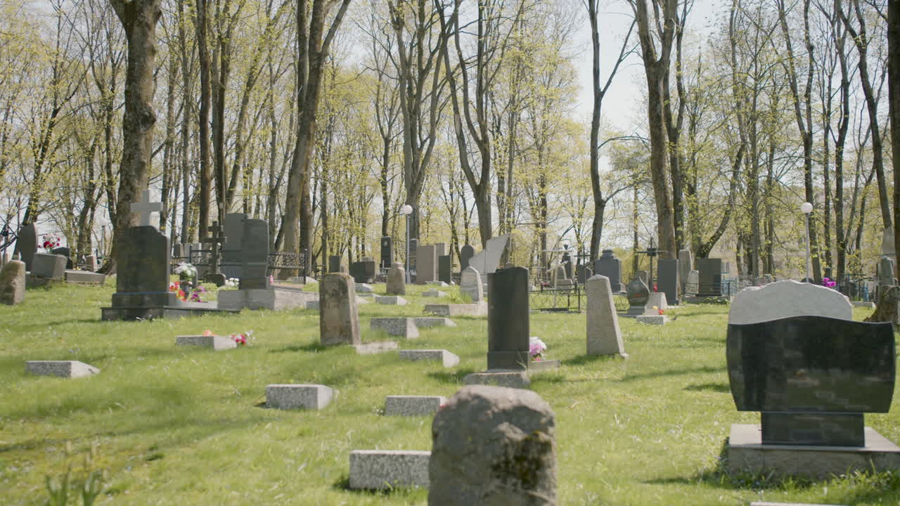 Premium stock video - Zoom in of a graveyard with tombstones in an ...