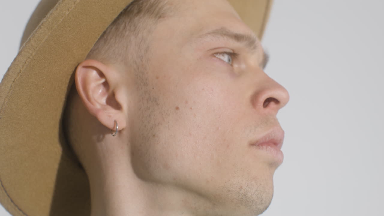 Free stock video - Close up portrait of handsome man moving his head