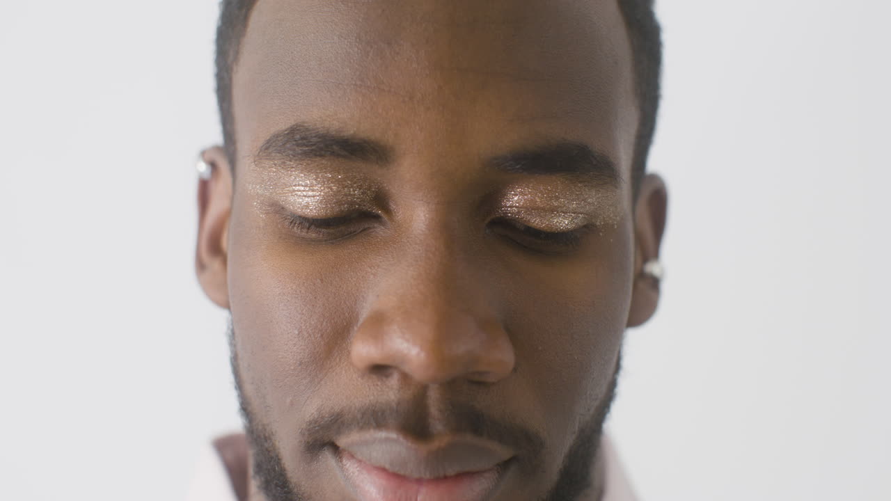 Free stock video - Close up of man staring at front with make up