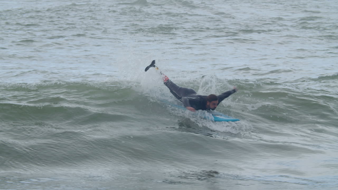 Premium stock video - Sportive man in wetsuit with artificial leg ...