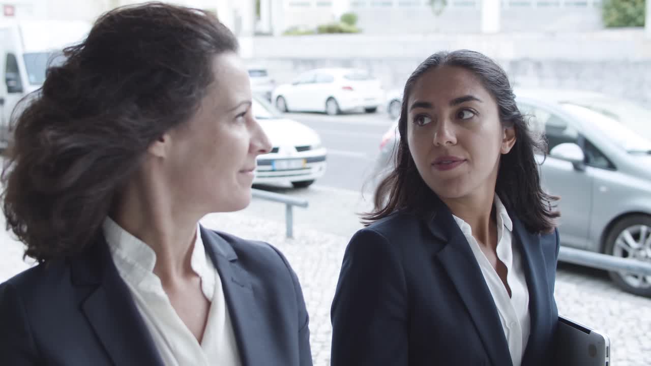 Premium stock video - Dolly shot of two serious business colleagues ... Premium stock video - Dolly shot of two serious business colleagues ...