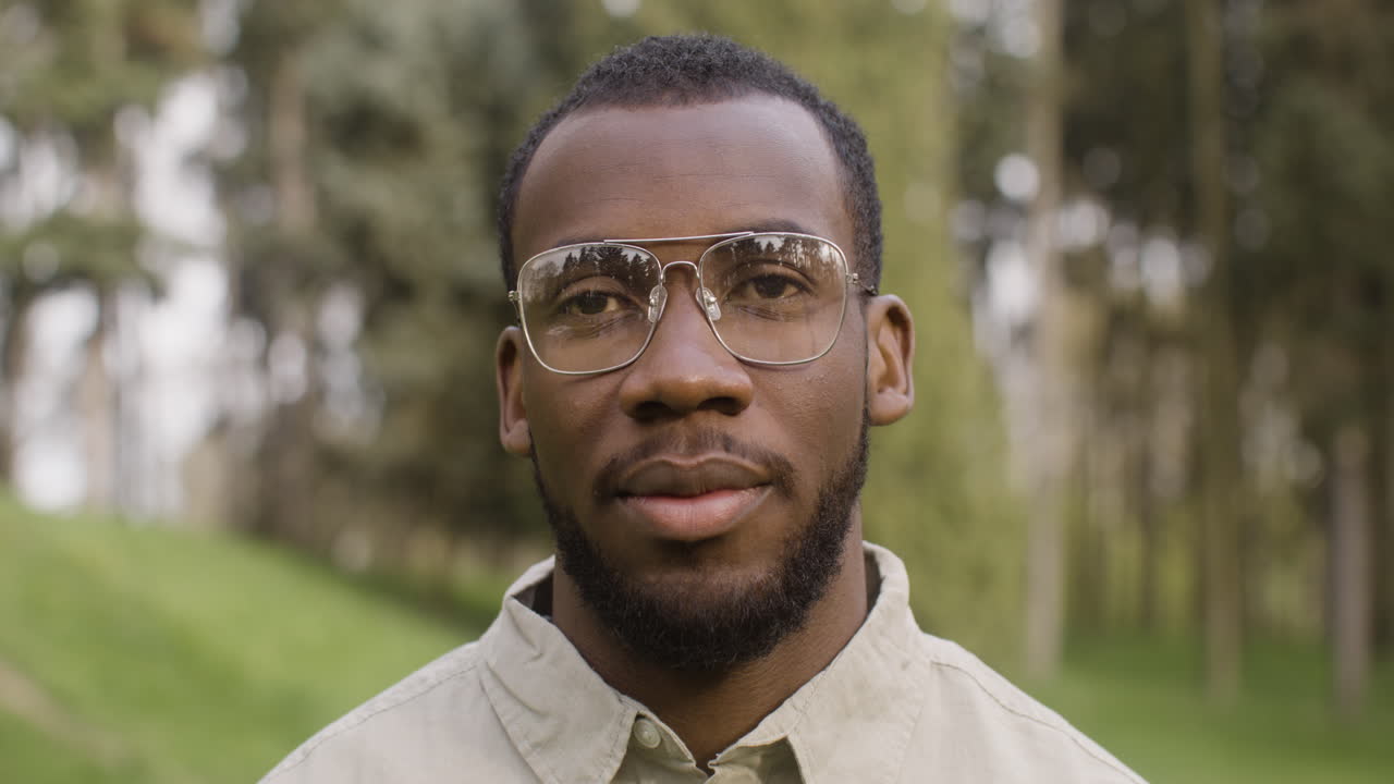 Free stock video - Portrait of an american man with eyeglasses standing ...