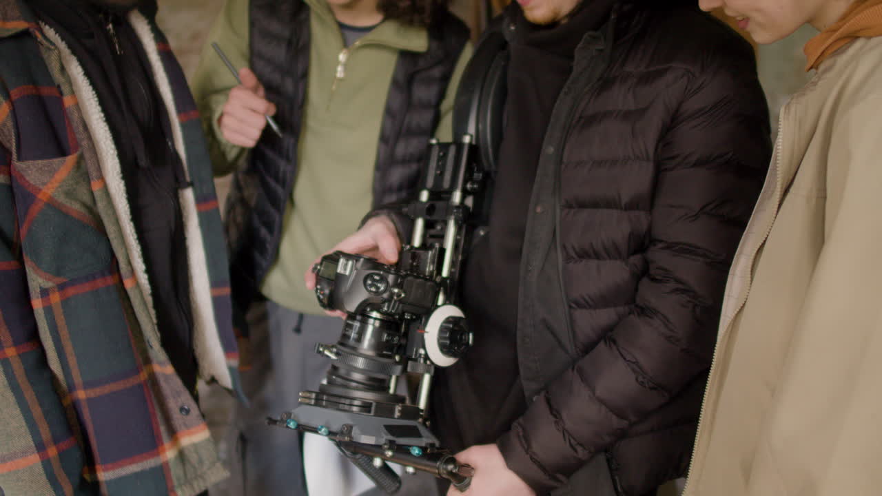 Premium stock video - Close up view of a production team and cameraman ...