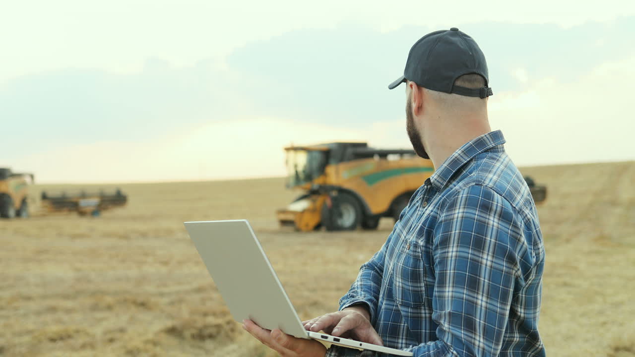 Free stock video - Succesful farmer working on laptop computer and ...