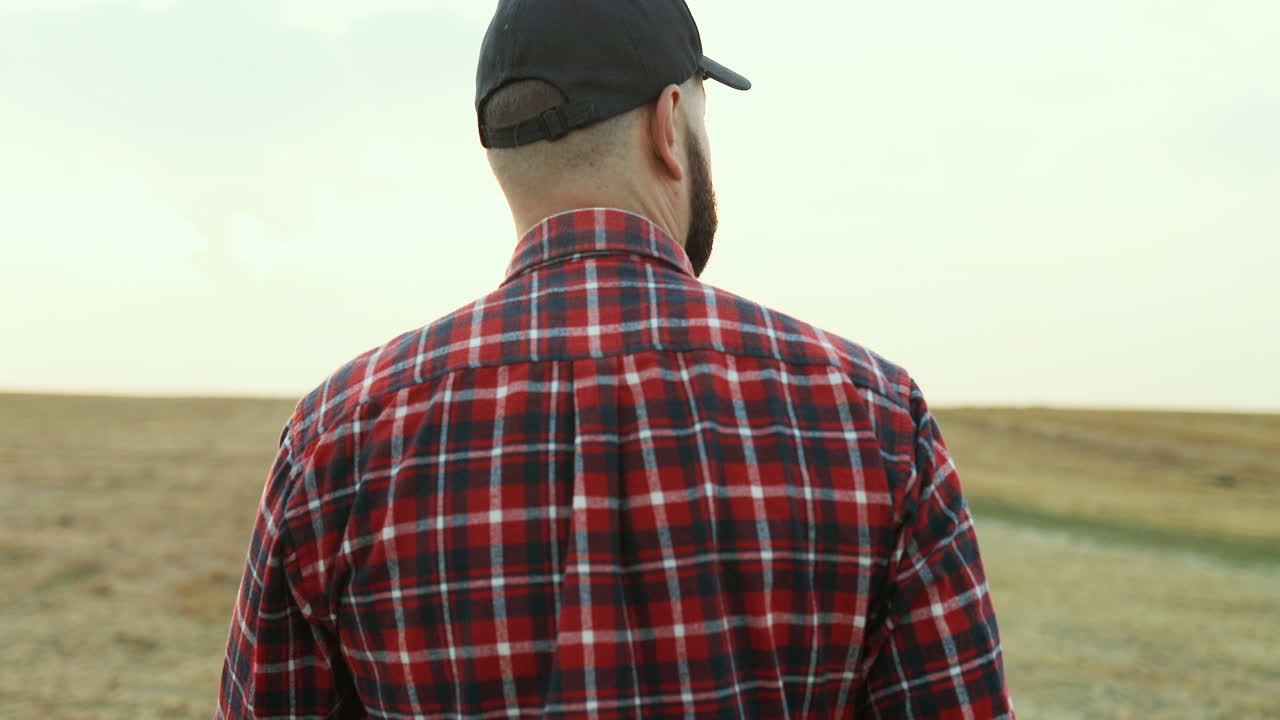 Free stock video - Rear of caucasian farmer wearing a baseball cap ...