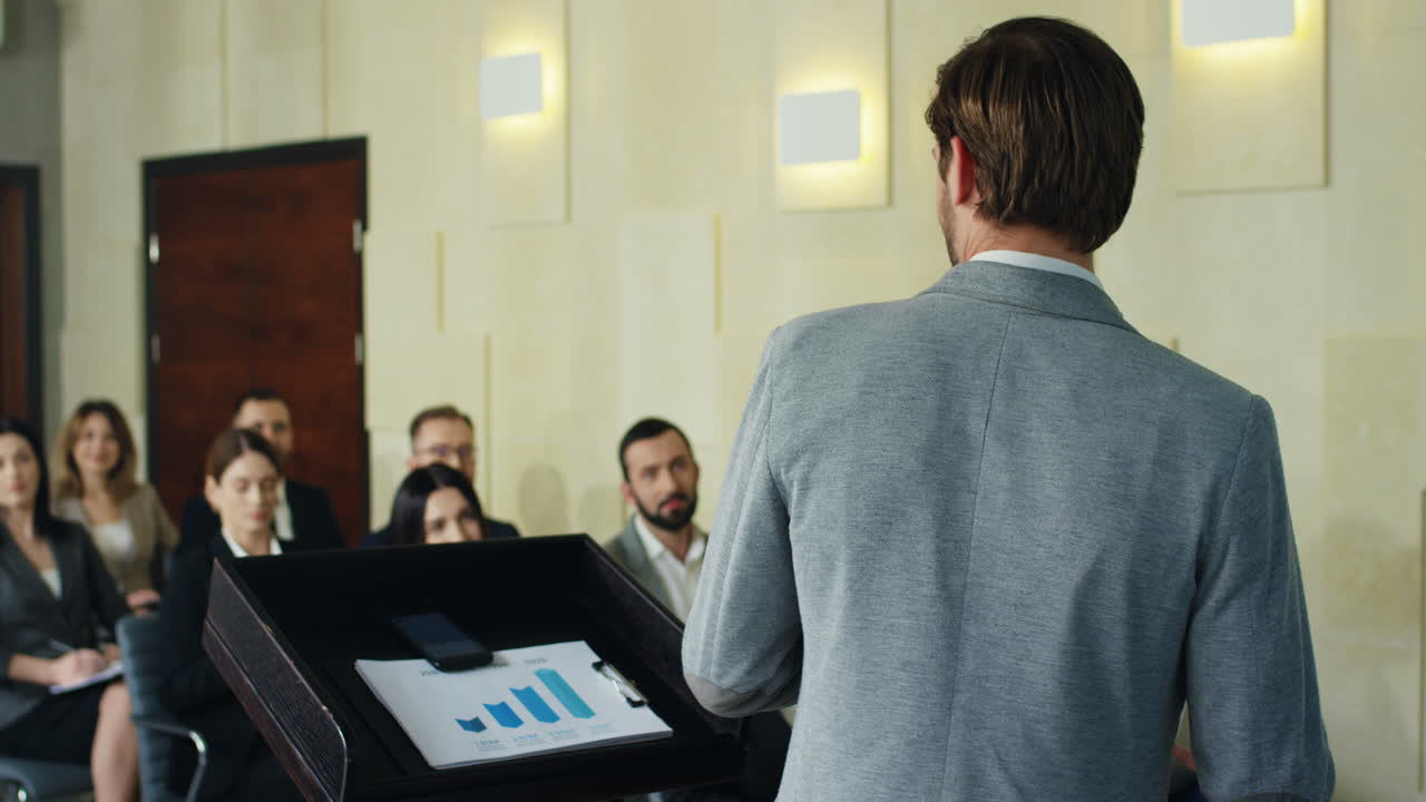 Free stock video - Rear view of caucasian businessman speaker on a ...