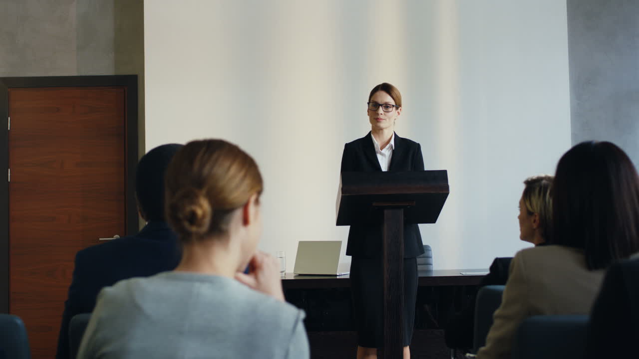 Free stock video - Caucasian female speaker on a podium making a speech ...