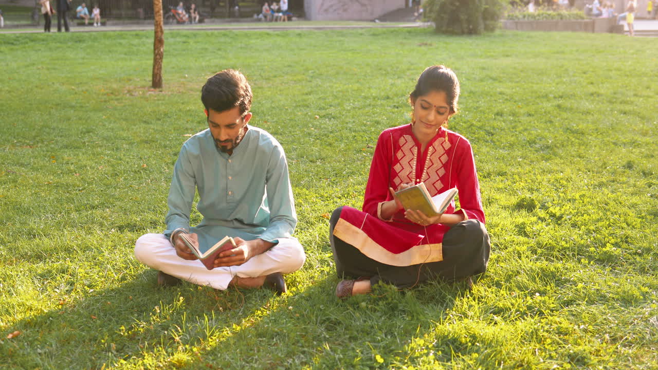 Free stock video - Indian couple reading in a park