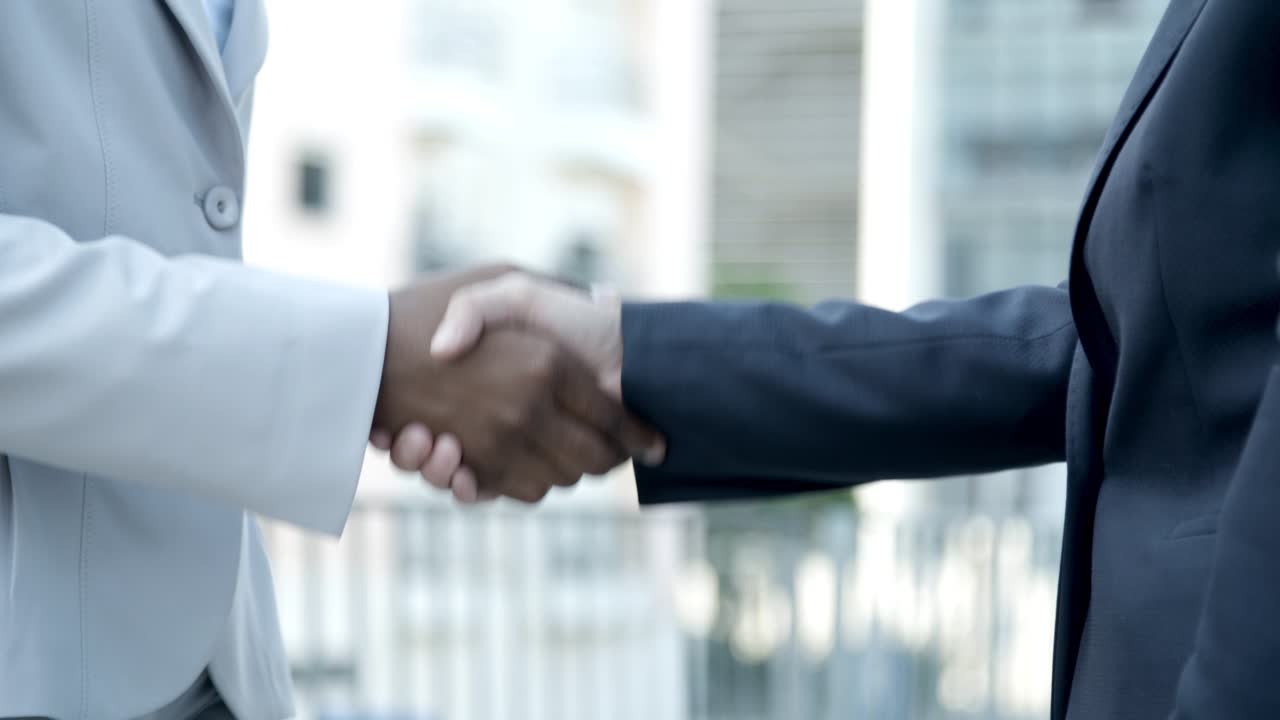 Free stock video - Slow motion shot of people shaking hands outdoor