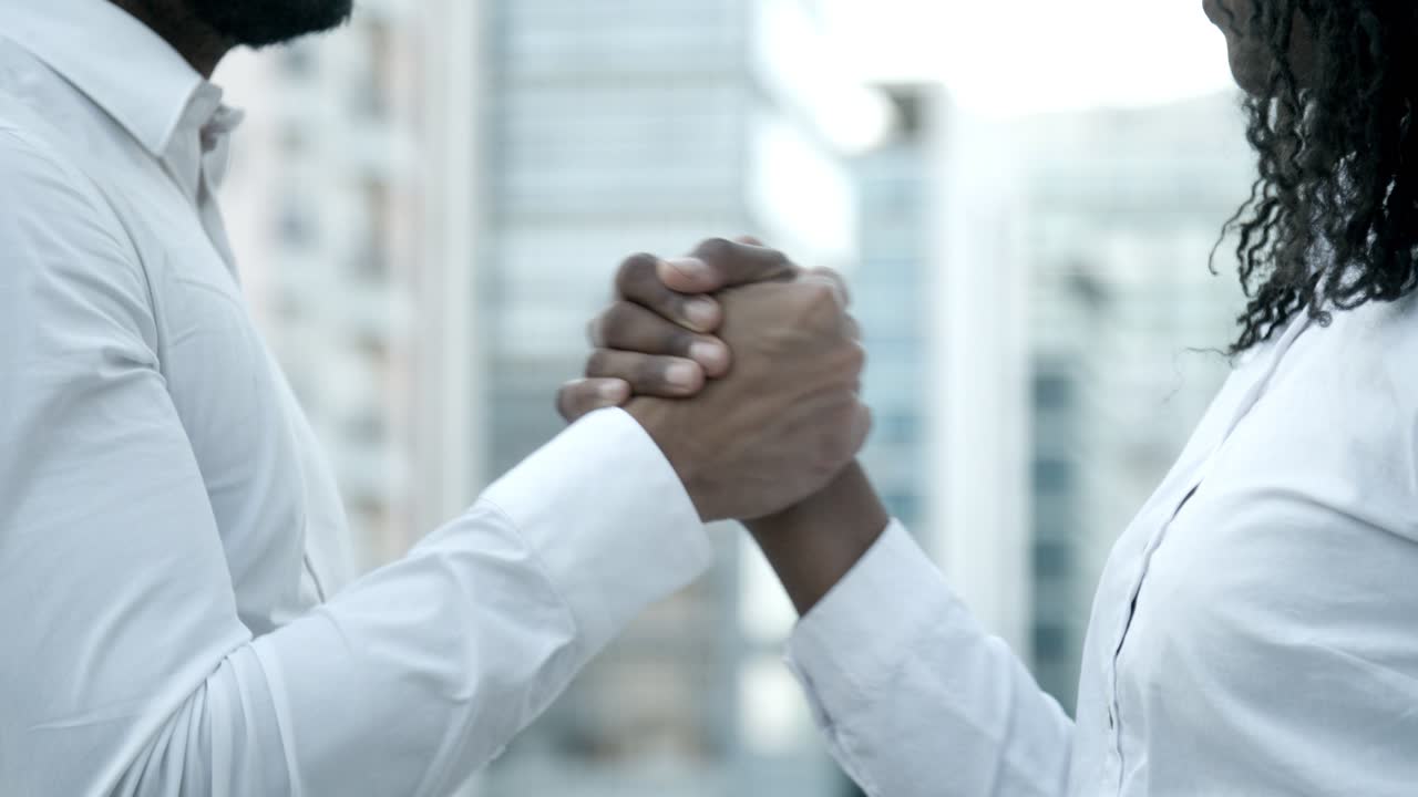 Free stock video - Slow motion shot of people shaking hands on street