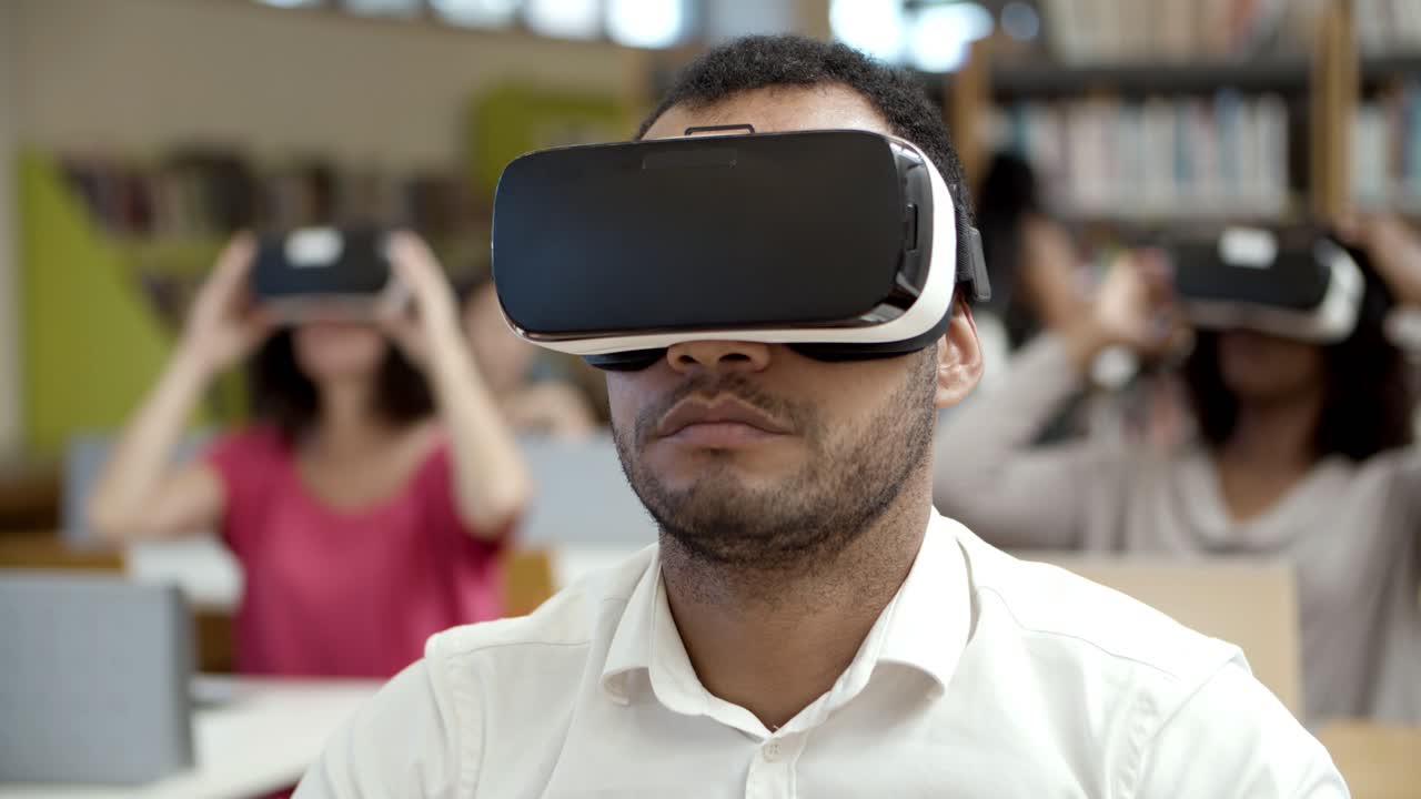 Free stock video - Front view of focused guy wearing vr headset