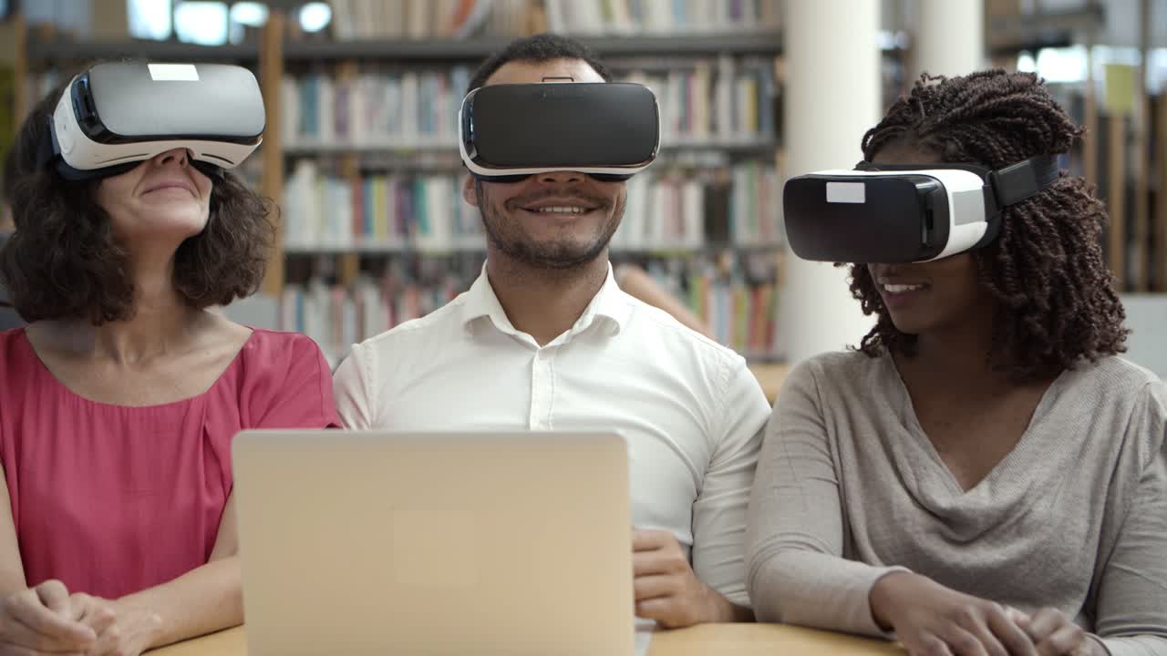 Free stock video - Slow motion of three testers with vr headsets