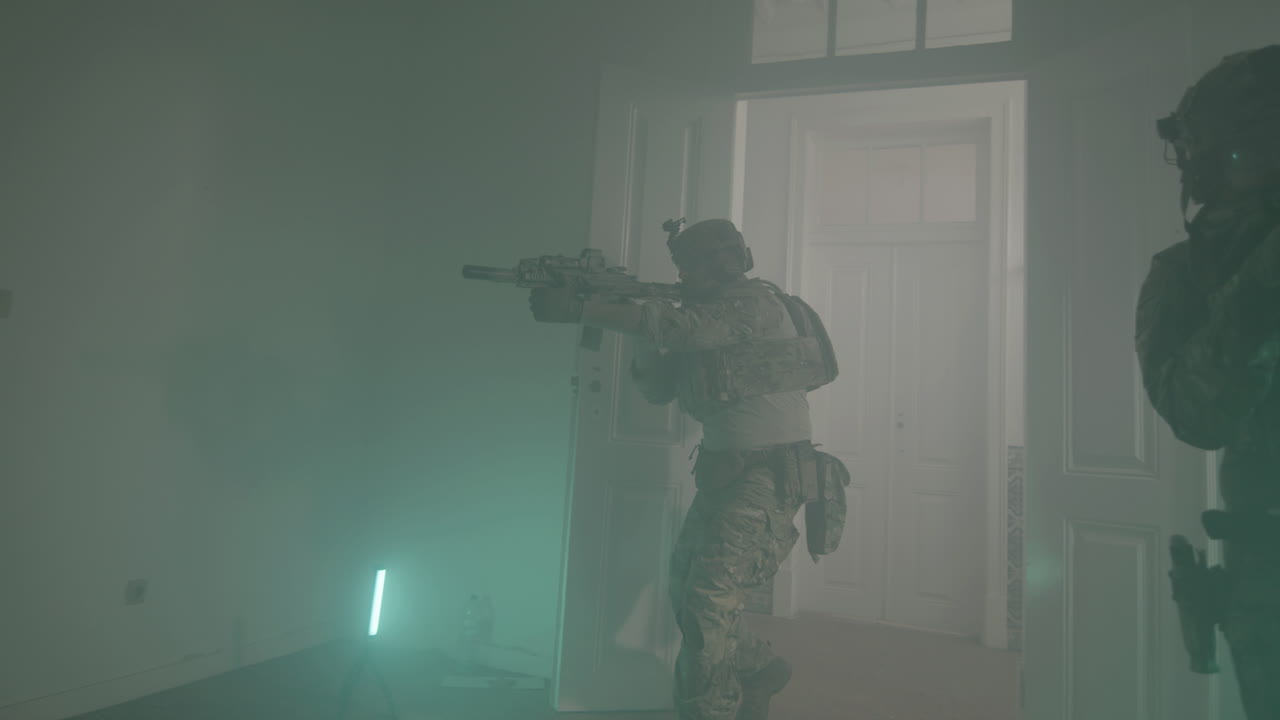 Free stock video - Soldiers opening door and entering into a room