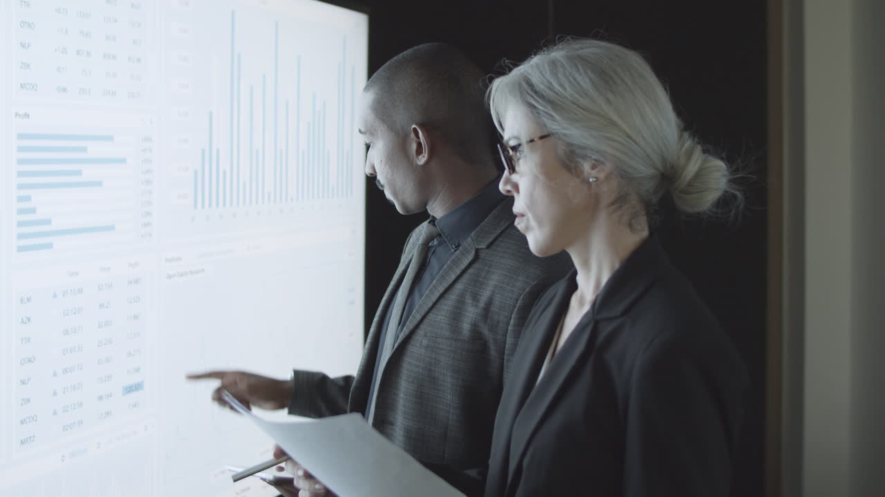 Free stock video - Finance broker explaining stock market statistics to ...