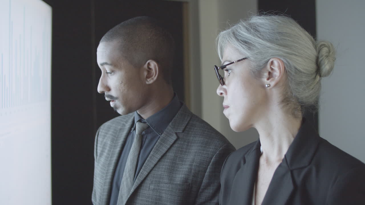 Free stock video - Finance experts analyzing stock market statistics