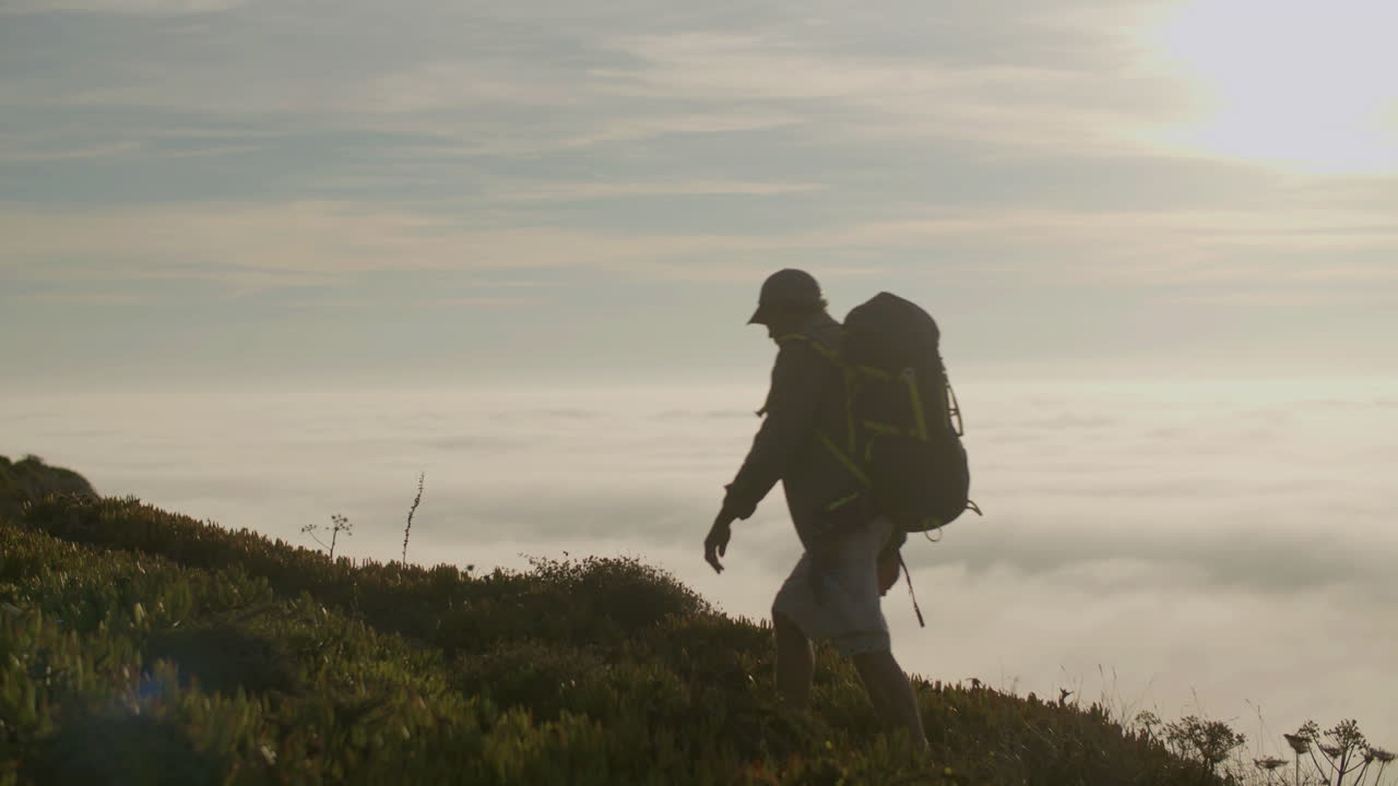 Free stock video - Senior hiker standing on the top of the mountain at ... Free stock video - Senior hiker standing on the top of the mountain at ...