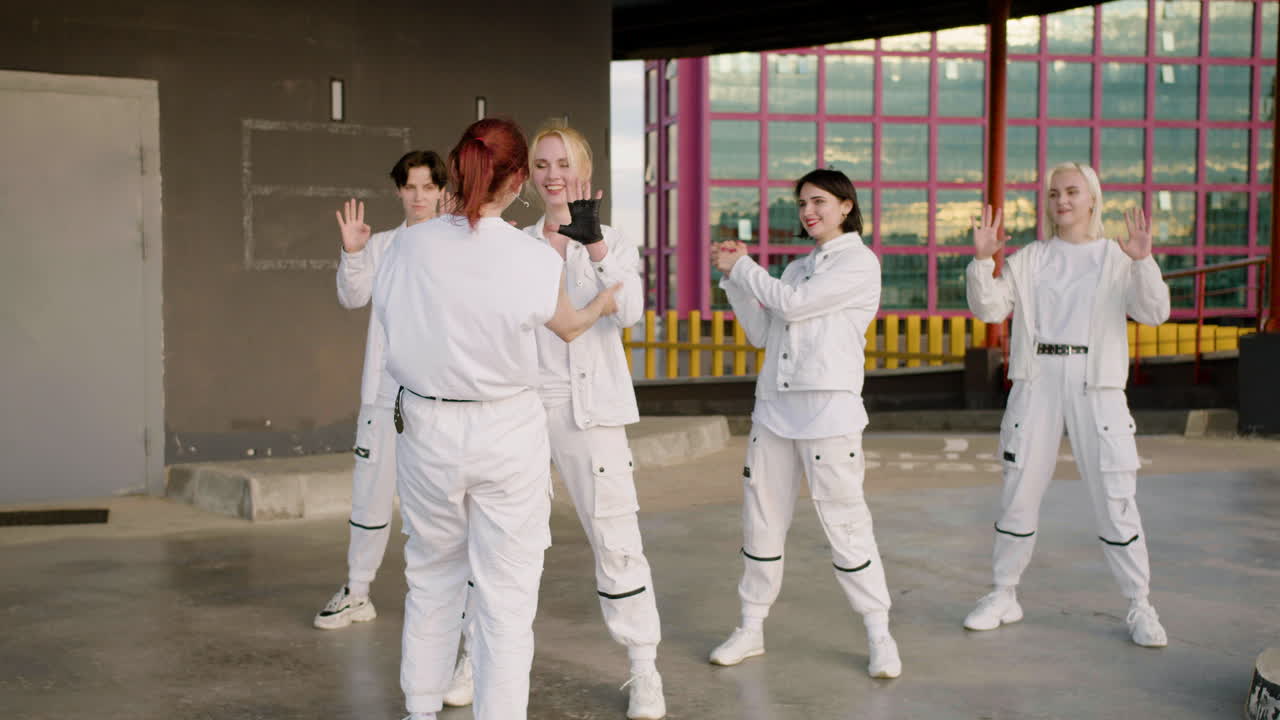 Free stock video - Ginger girl helping with the moves to k-pop group