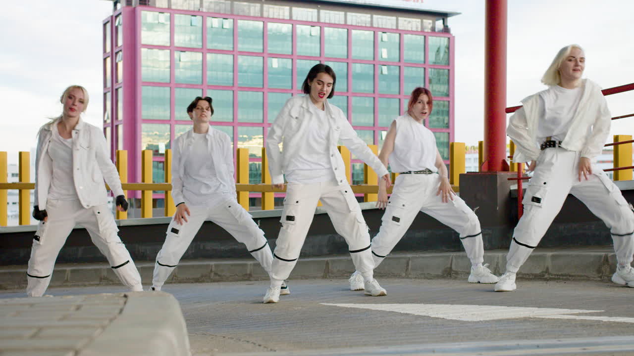 Free stock video - Front view of k-pop female group performing on the road