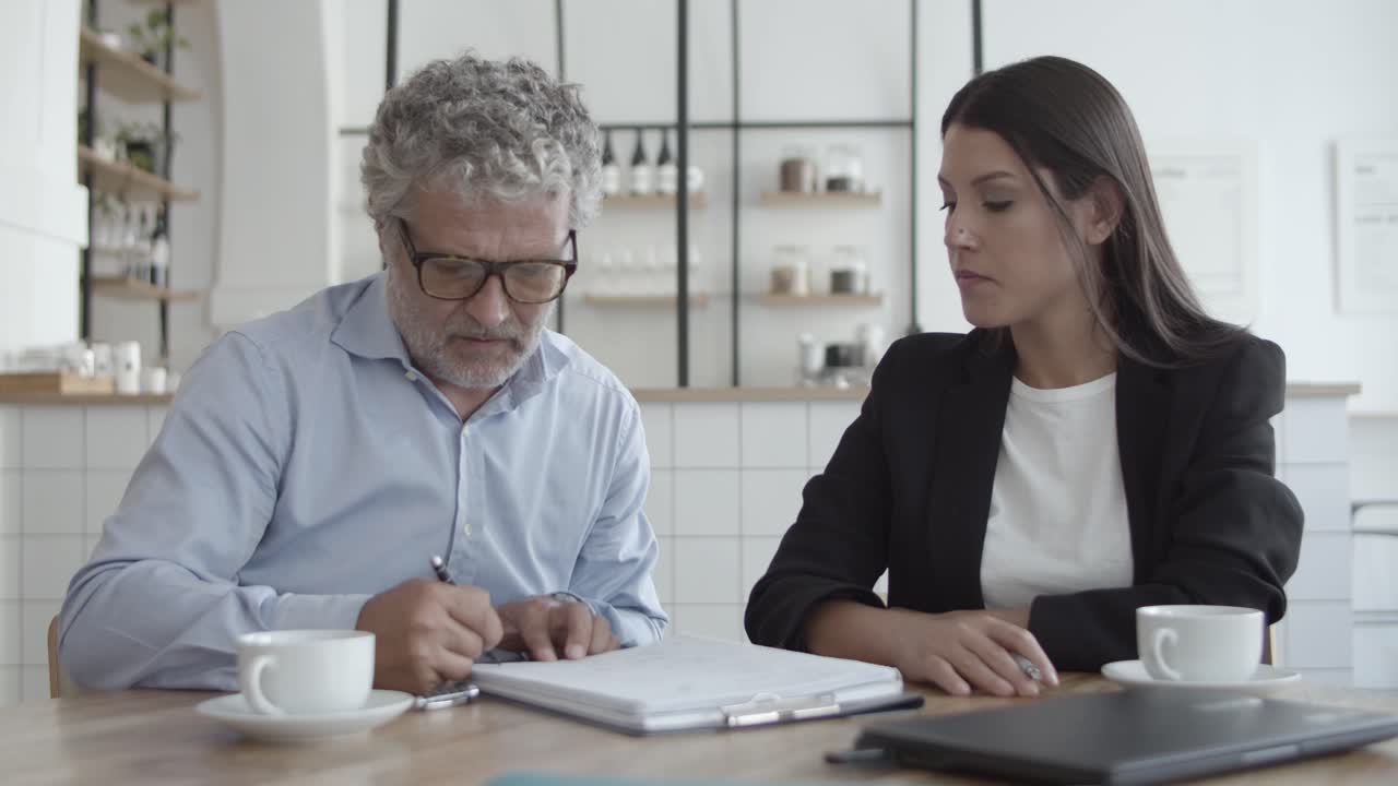 Free stock video - Mature male client meeting with insurance agent