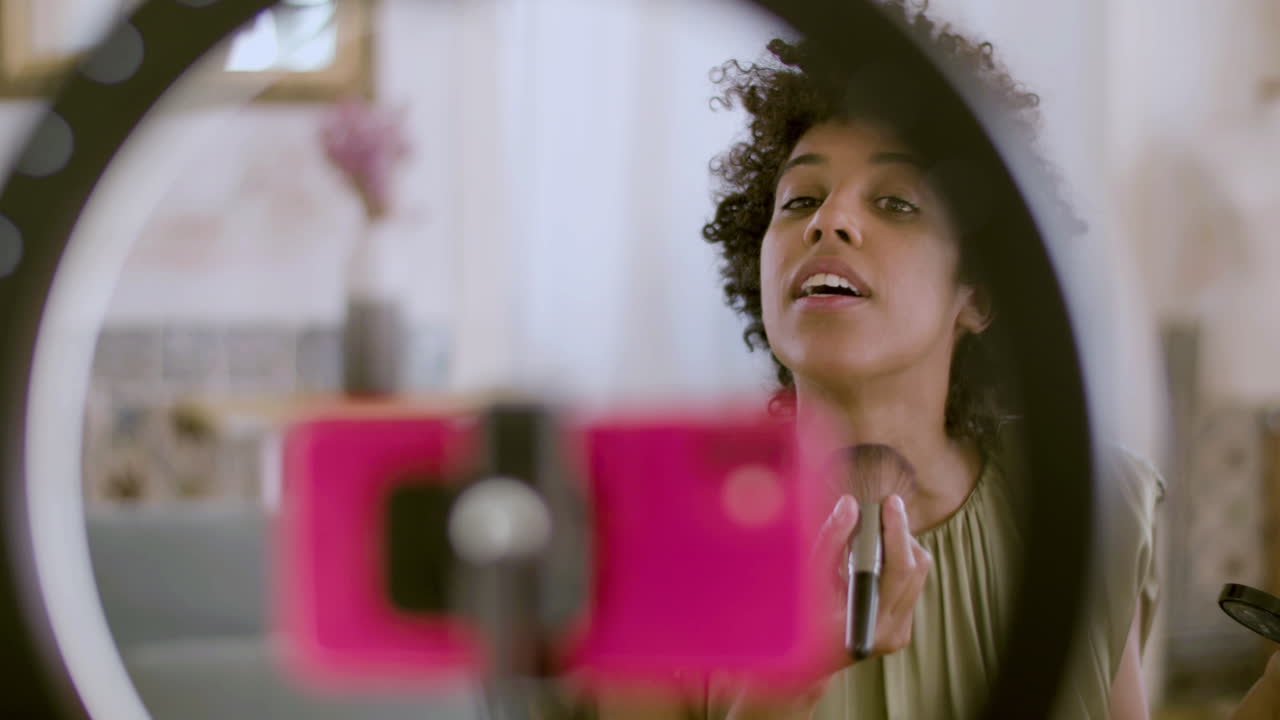 Free stock video - African american vlogger streaming makeup tutorial ...