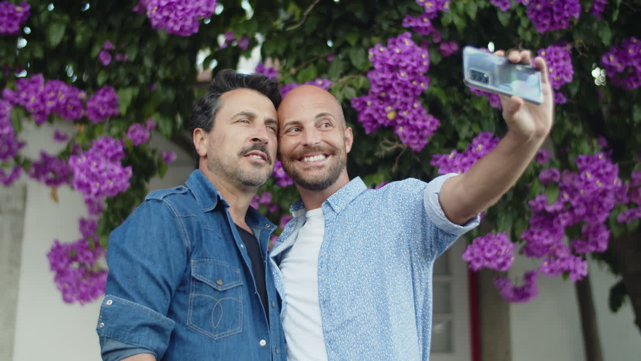 Free Stock Video Happy Gay Couple Doing Selfie On Phone In Park