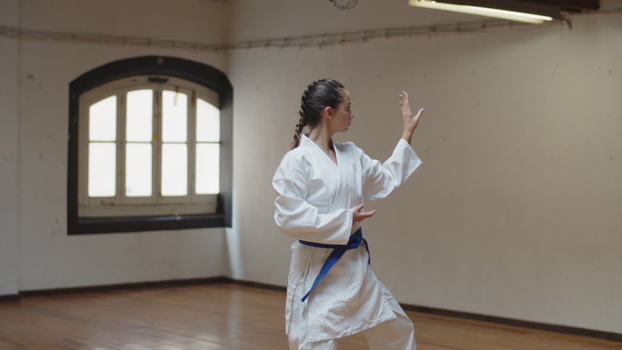 Free stock video - Medium shot of female fighter standing in defending ...