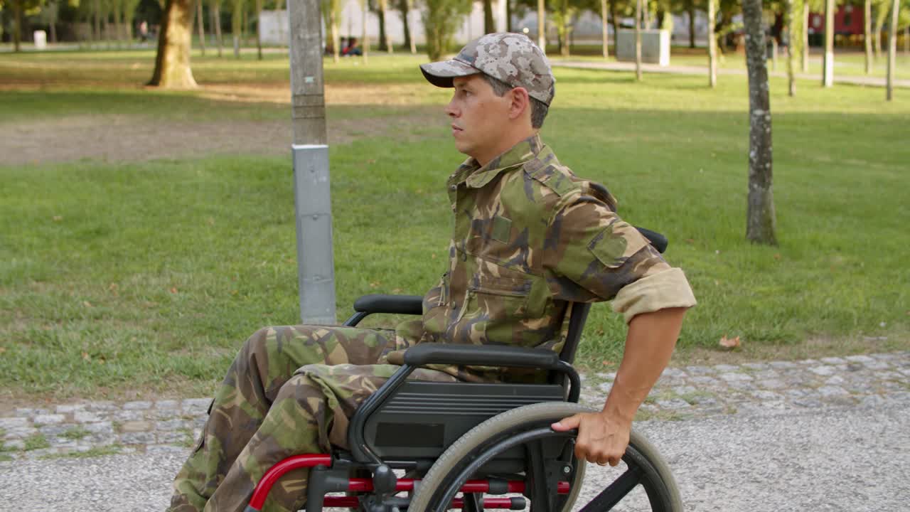 Free stock video - Serious disabled military man in wheelchair