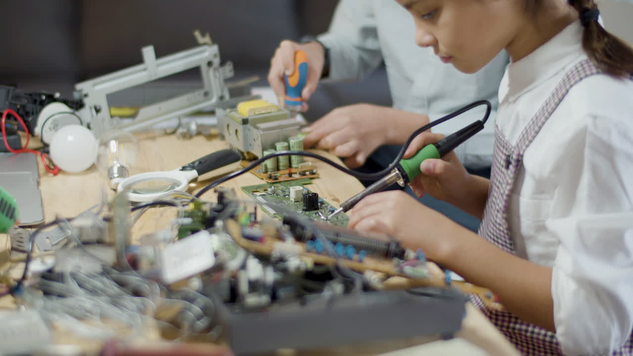 Free stock video - Two young classmates doing school project together