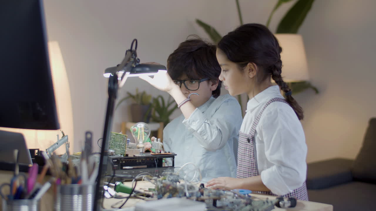 Free stock video - Two secondary school students doing project together