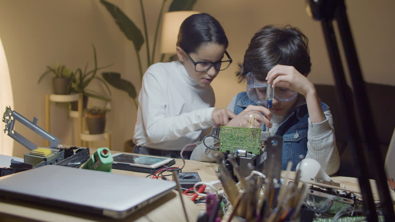 Free stock video - Two children doing interesting project together