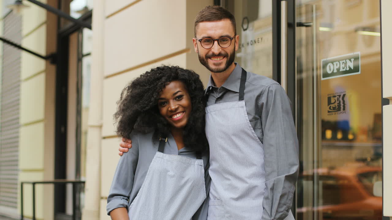 Free stock video - Portrait of female and male waiters hugging and ...
