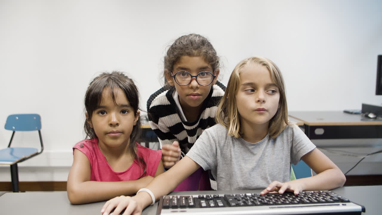 Free stock video - Girls looking at monitor and learning computer science