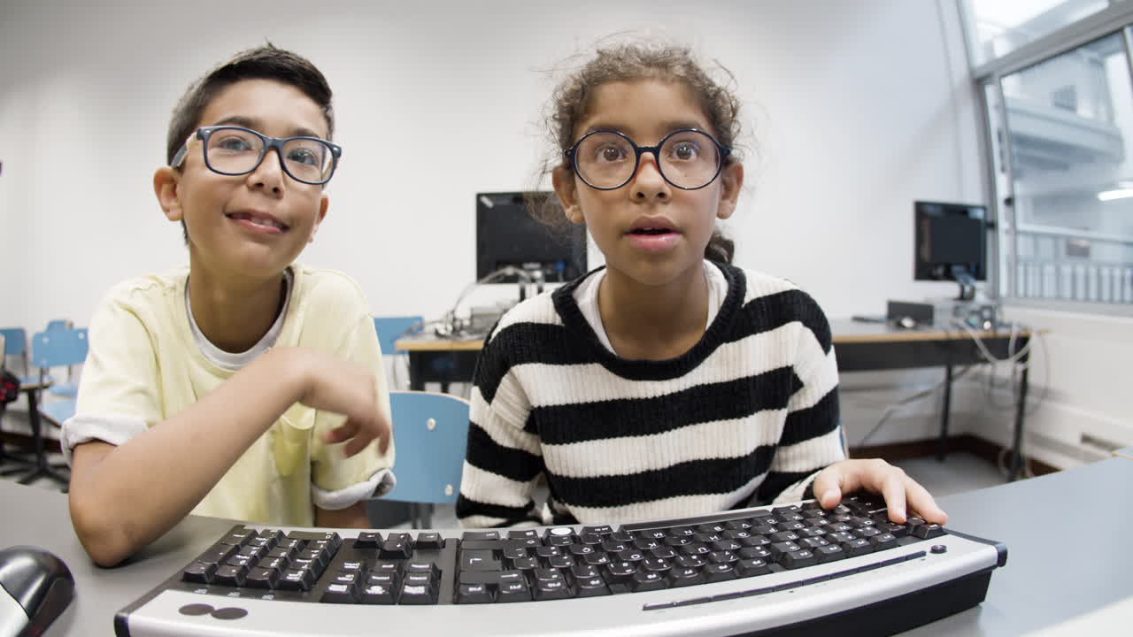 Free stock video - Schoolkids sitting at table and typing on computer ...
