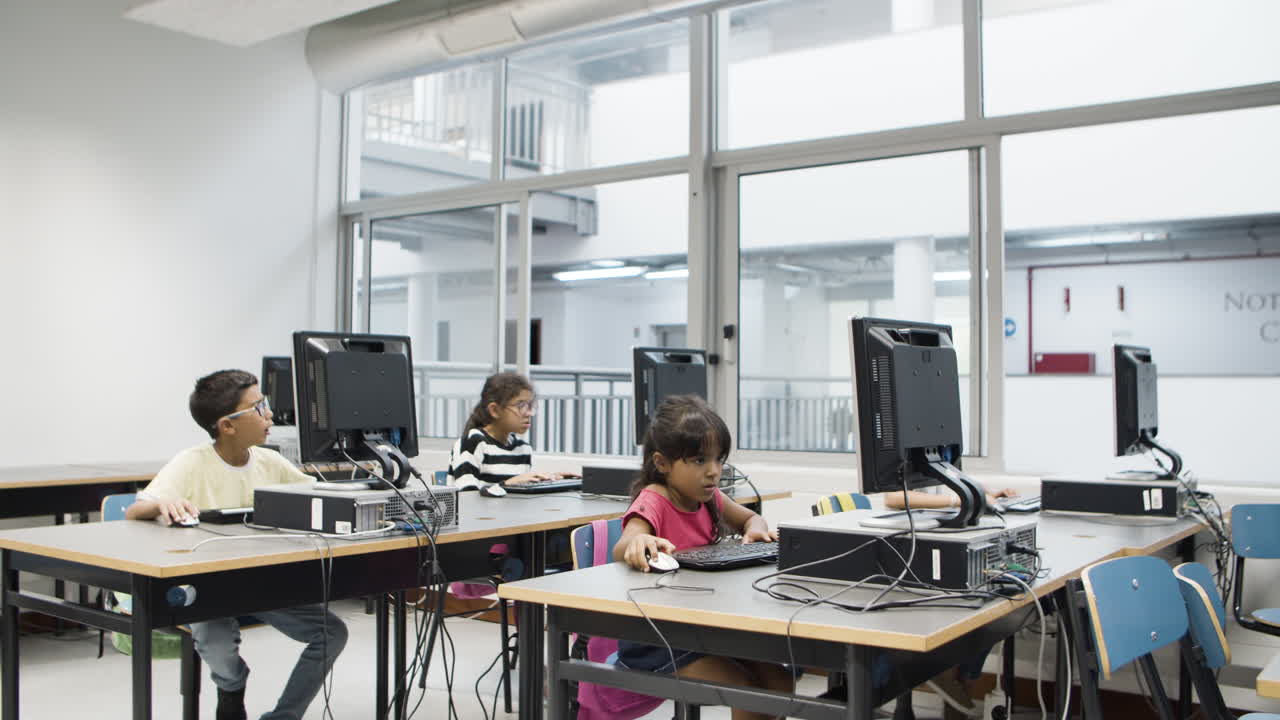 Free stock video - Focused multiethnic children learning computer science