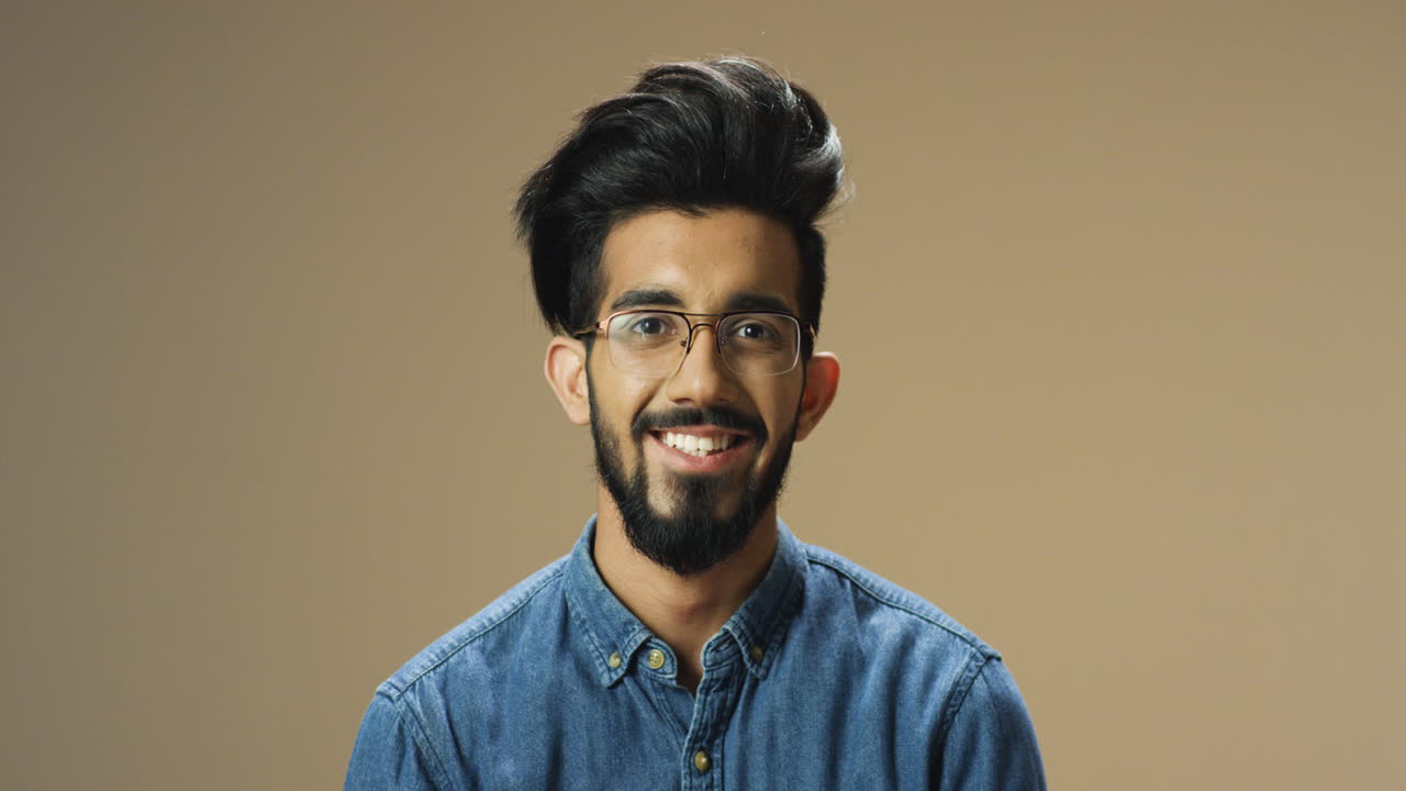 Free stock video - Young handsome indian man with beard and glasses ...