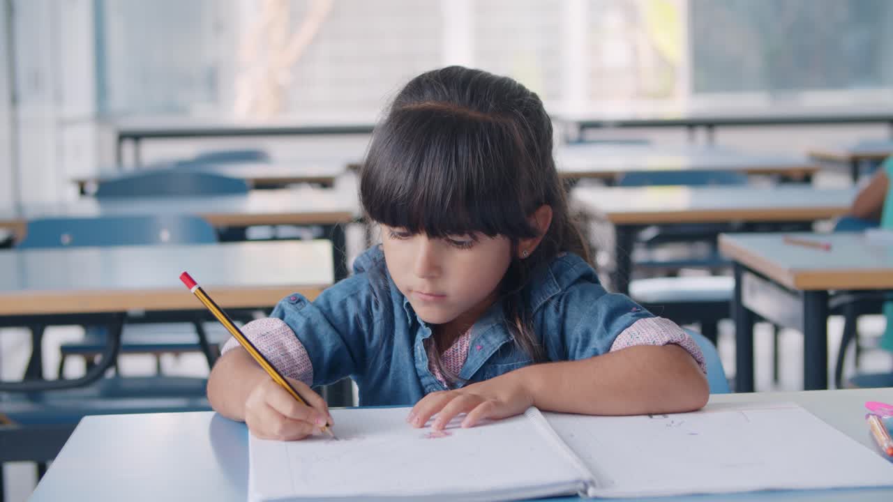 Free stock video - Focused primary school pupil girl holding pencil and ...