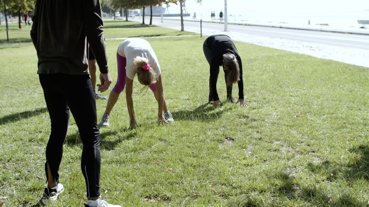 Free stock video - Middle aged men and women bending bodies