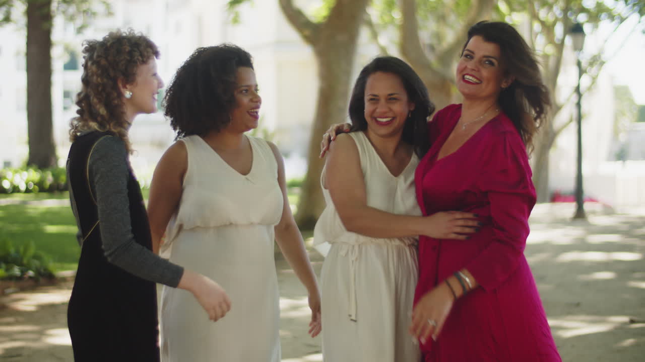 Free stock video - Friends hugging with brides in park after wedding ...