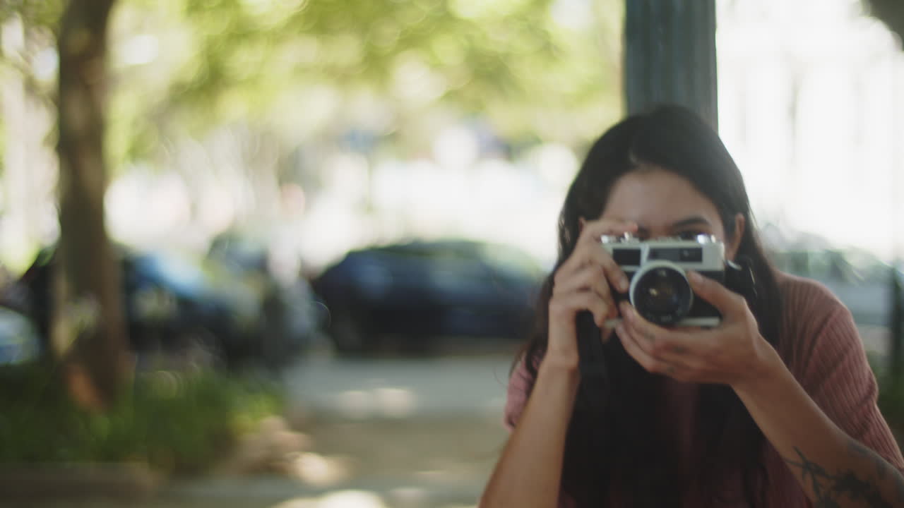 Free stock video - Happy female photographer taking pictures from ...