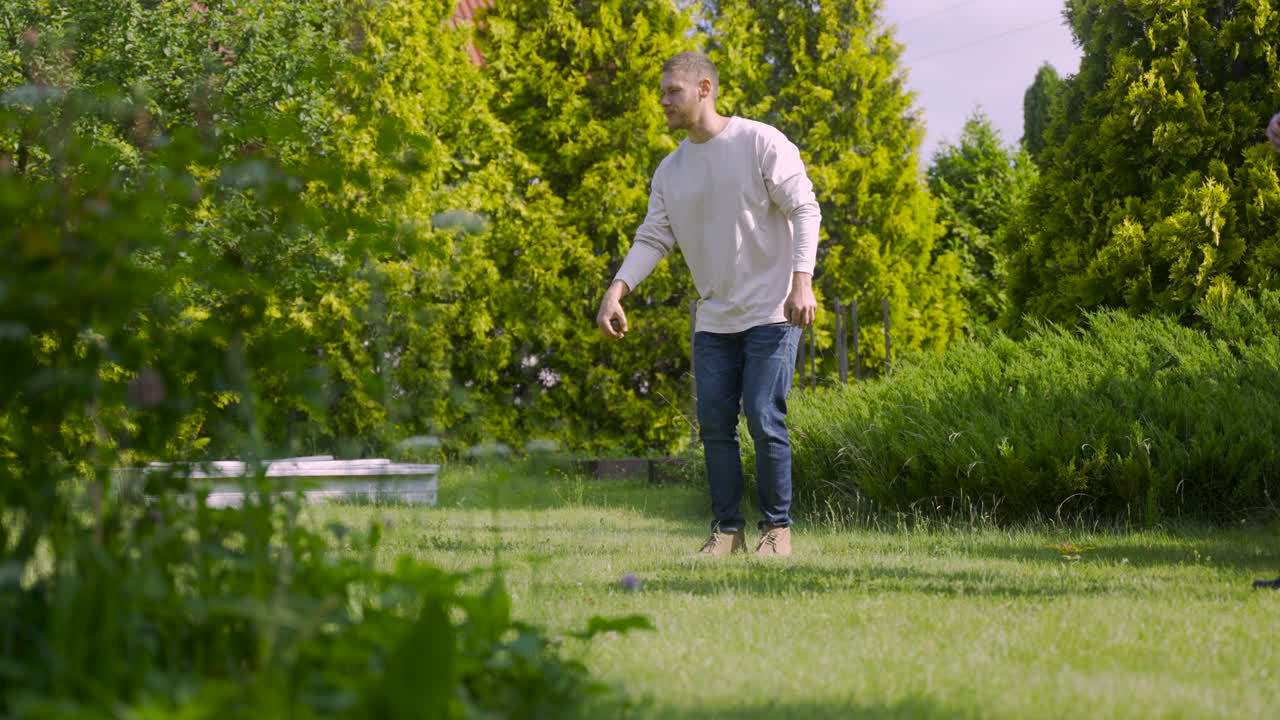 Free stock video - Side view of caucasian young man playing petanque in ... Free stock video - Side view of caucasian young man playing petanque in ...
