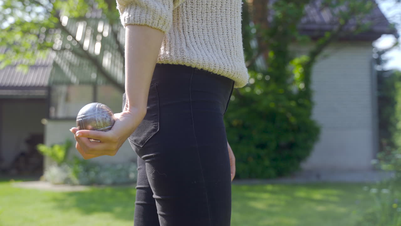 Free stock video - Close-up view of a woman hand holding a petanque ...