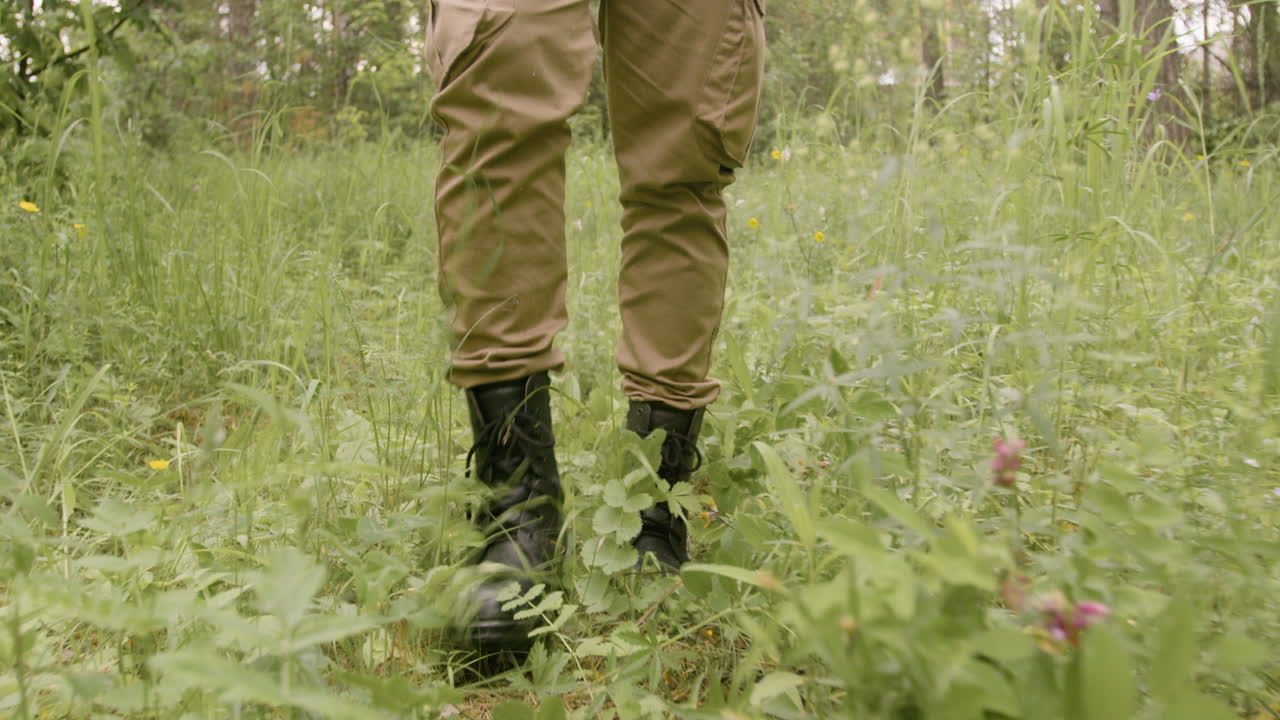 Free stock video - Close-up view of the feet of forest warden in boots ...