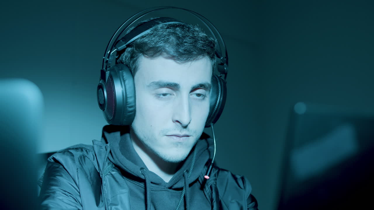 Free stock video - Young caucasian hacker with headphones sitting at ...